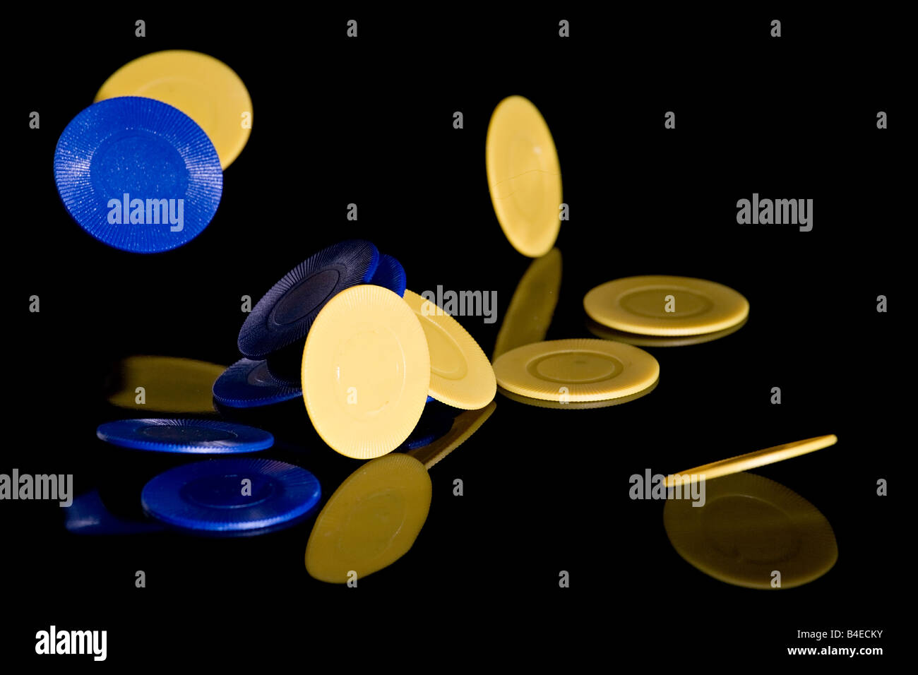 falling counters isolated on black background Stock Photo - Alamy