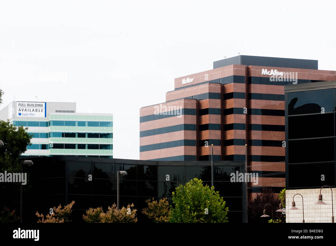 Rental sign displaying rental availability of high rise office complex ...