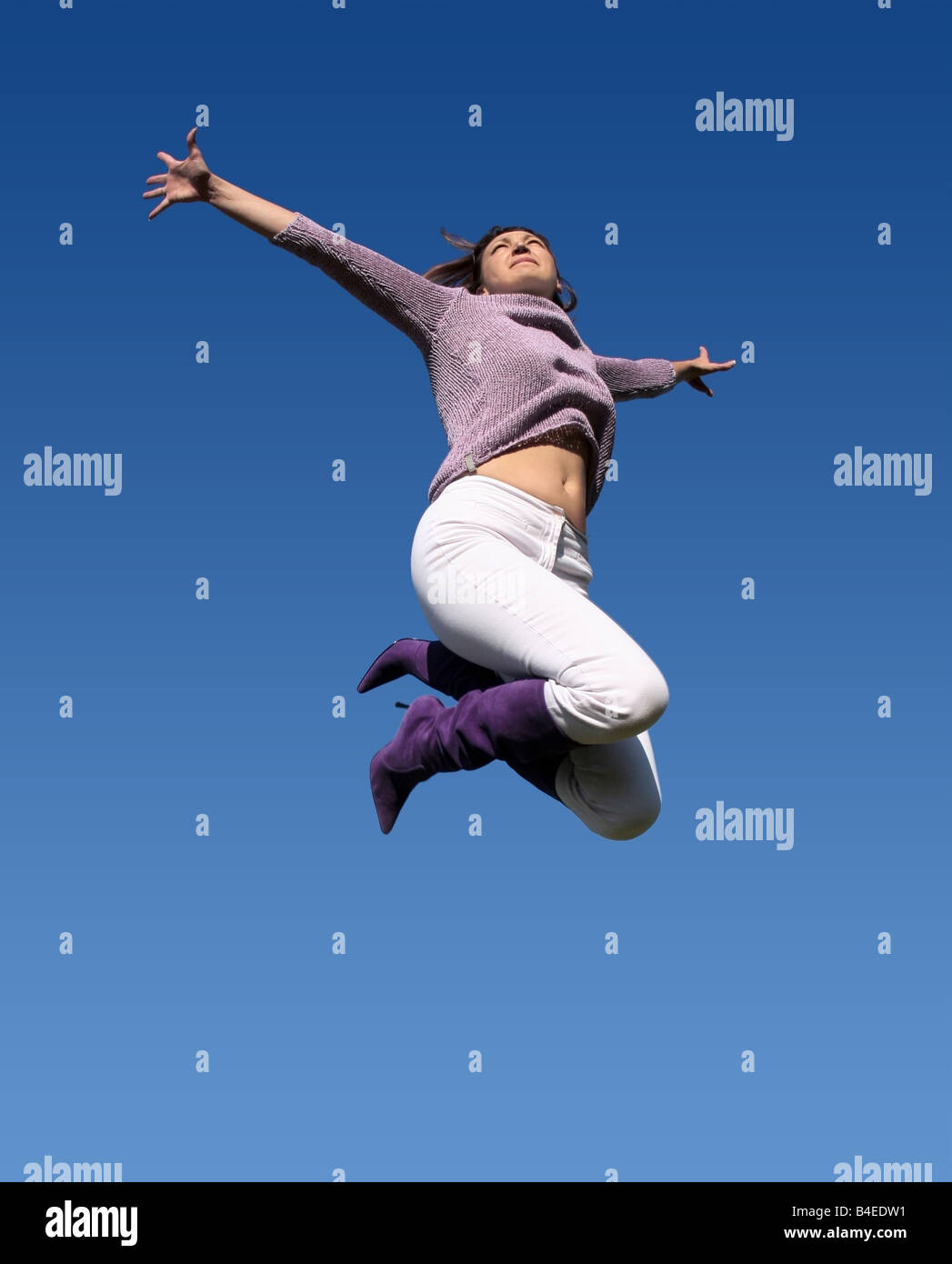 Young woman jumping high hi-res stock photography and images - Alamy