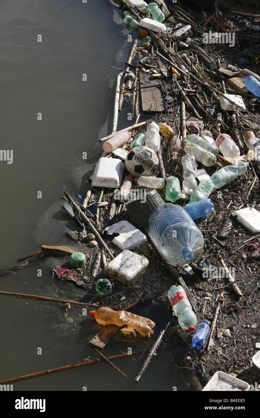 rubbish floating on polluted river surface Stock Photo - Alamy