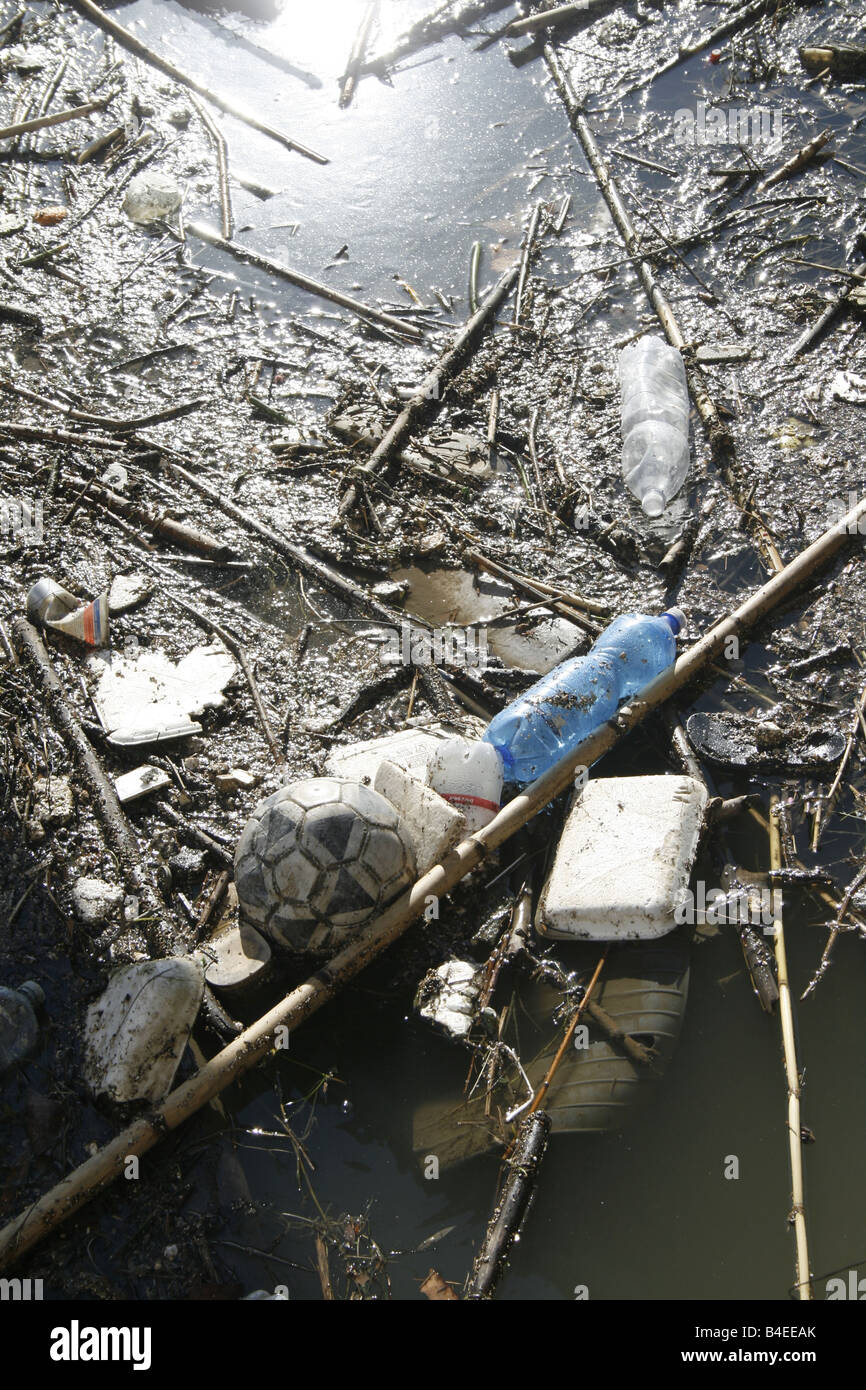 rubbish floating on polluted river surface Stock Photo - Alamy