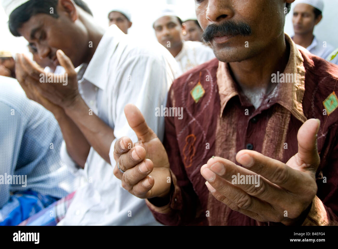 people from Muslim community offer prayers to Allah(God) at Id festival ...