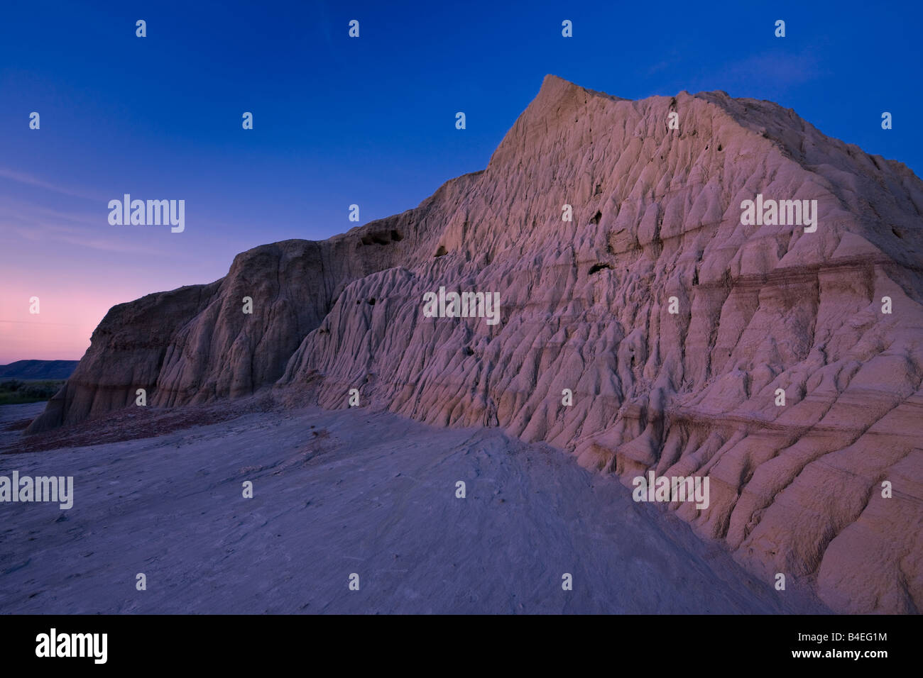 Formations of Castle Butte during dusk in Big Muddy Badlands, Southern ...