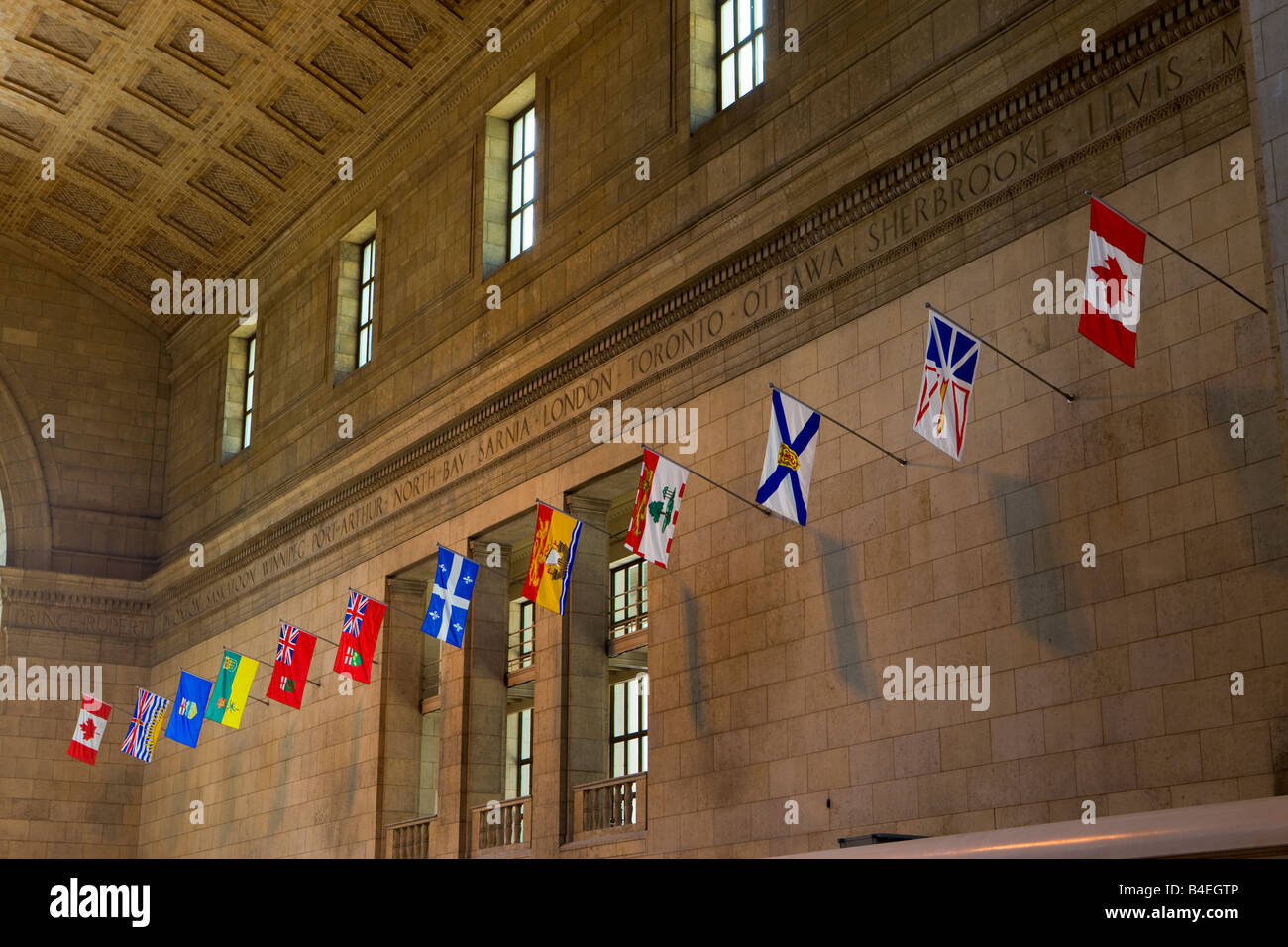 Flags lining walls ticket lobby hi-res stock photography and images - Alamy