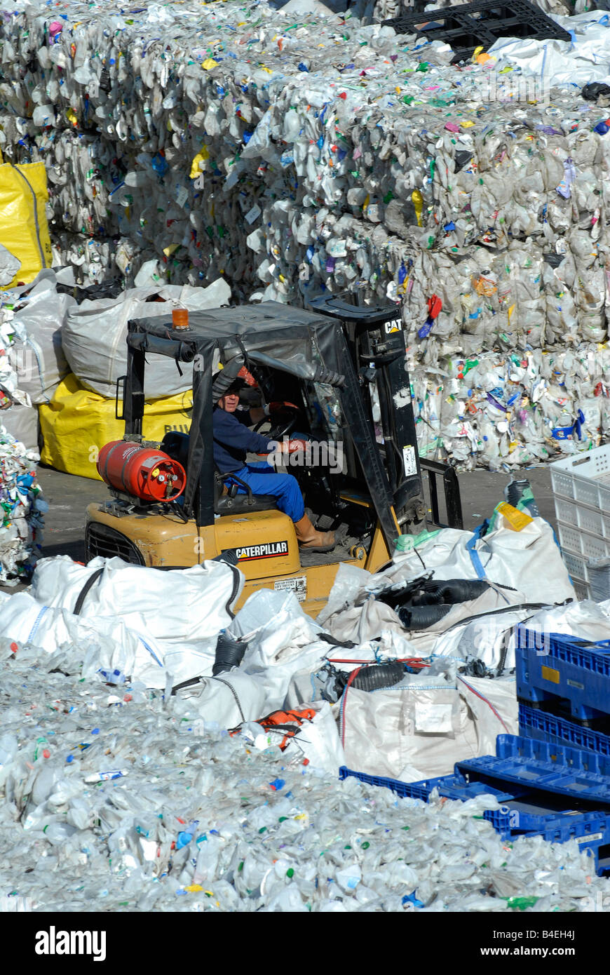 Gas powered forklift truck operating in the storage yard of a waste ...