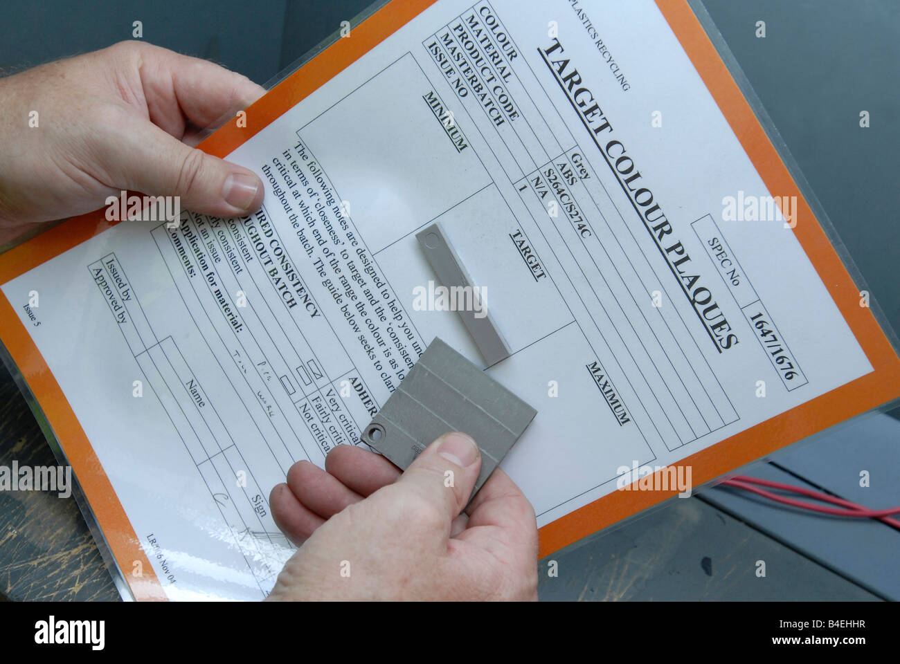 Colour matching a test piece of recycled plastic against a standard ...