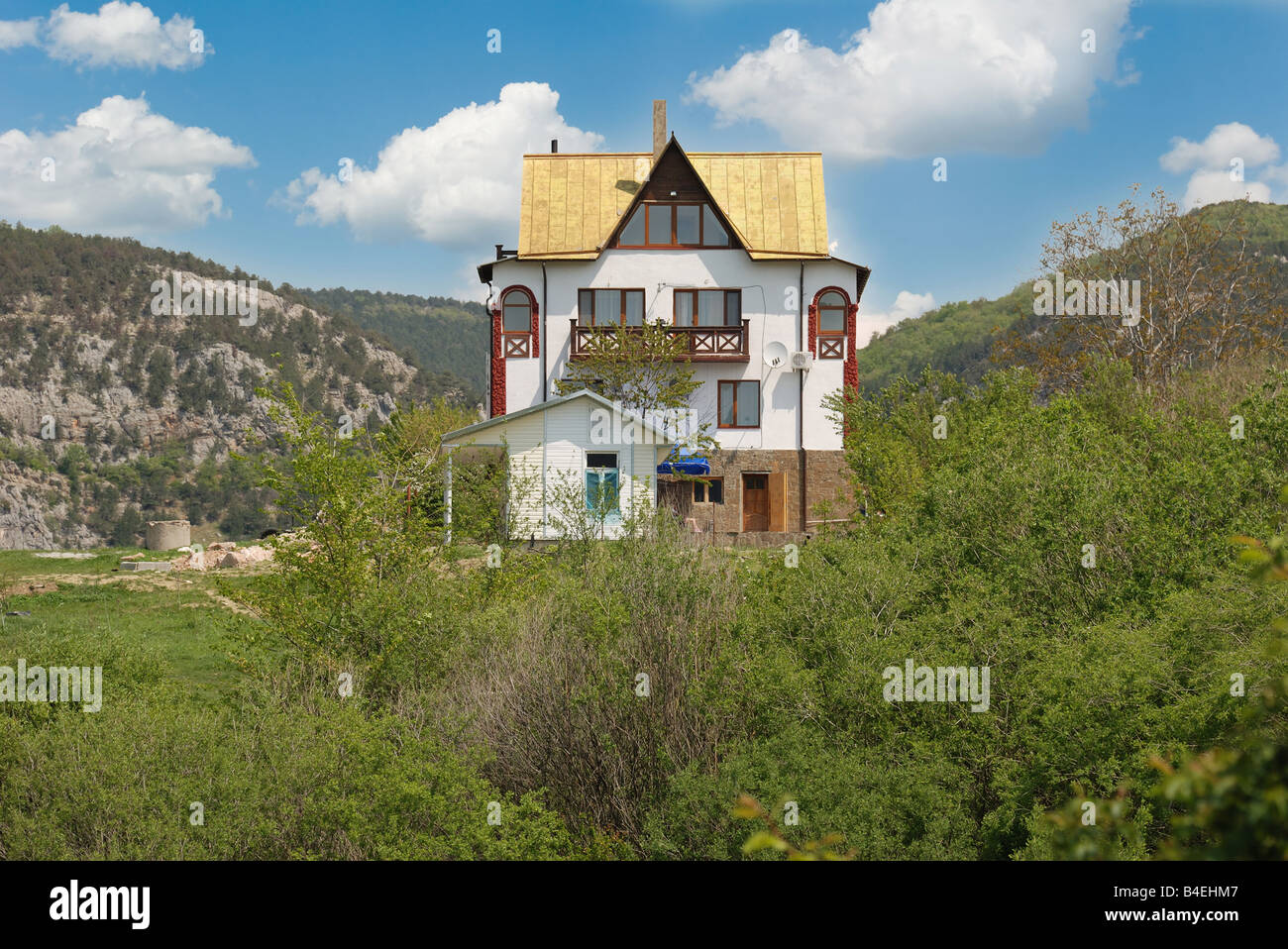 The house in a valley Crimean mountains and a cottage Stock Photo - Alamy