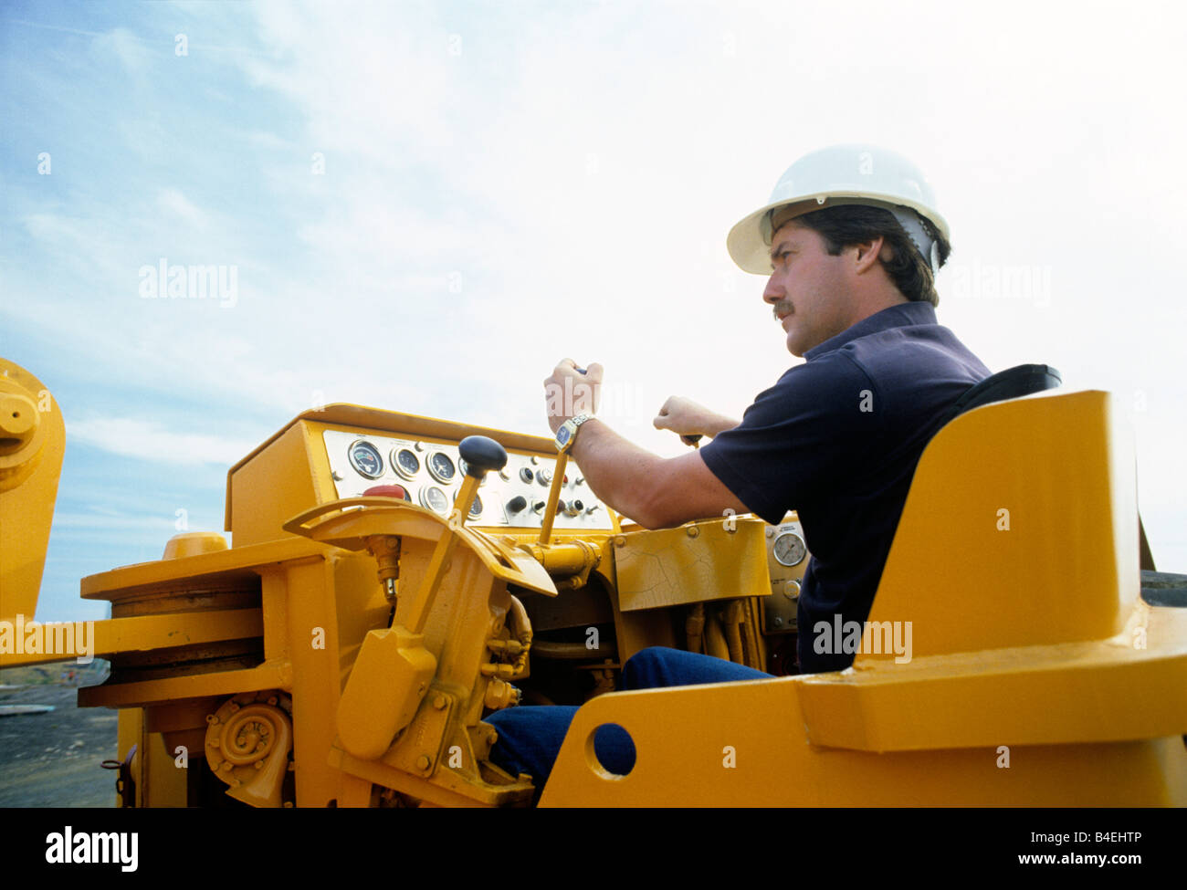 man operating earth moving equipment Stock Photo - Alamy
