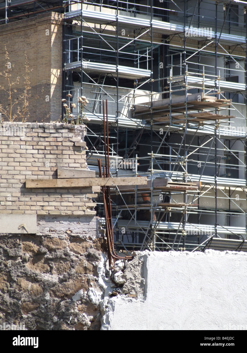 scaffolding and damaged brick wall Stock Photo - Alamy
