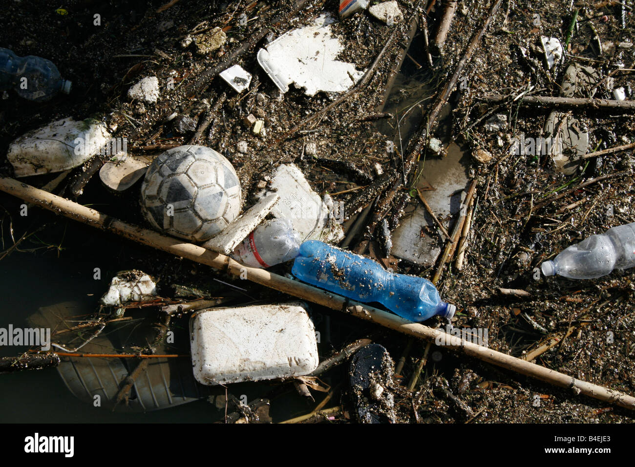 rubbish floating on polluted river surface Stock Photo - Alamy