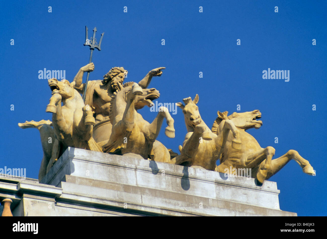 Statue of Neptune with trident riding chariot on finial of Borse stock ...