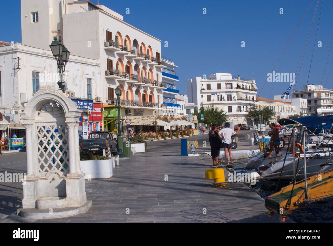 Drinking Fountain on Waterfront with Restaurant and Church in Tinos ...