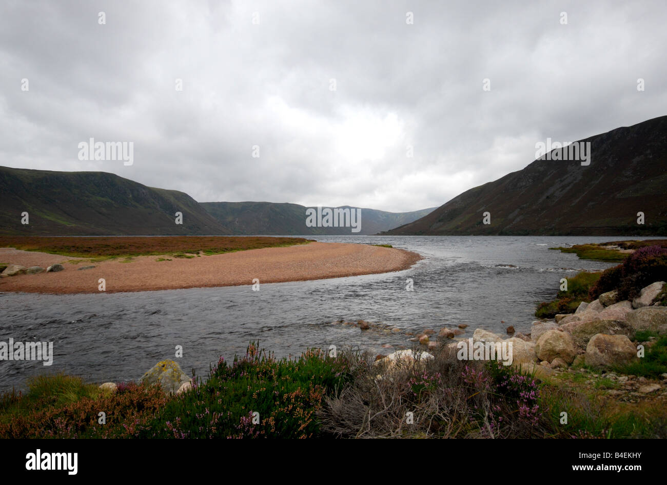The river Muick flows from the loch of the same name around a shingle ...