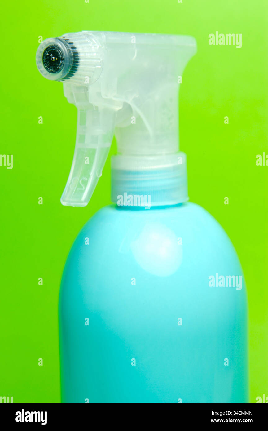 Cleaning products isolated against a green background Stock Photo - Alamy