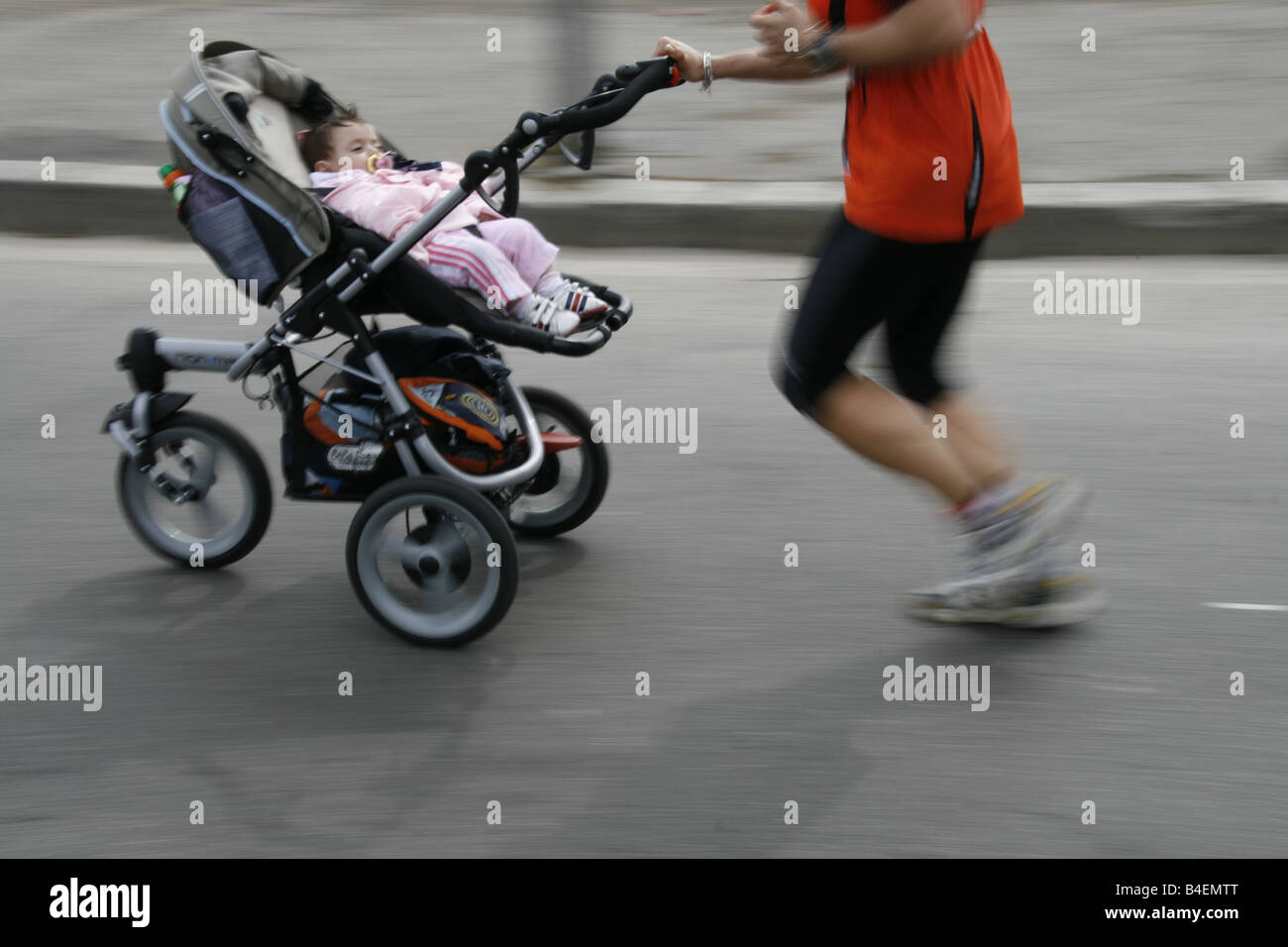 woman pushing pram in rome marathon 2008 Stock Photo - Alamy