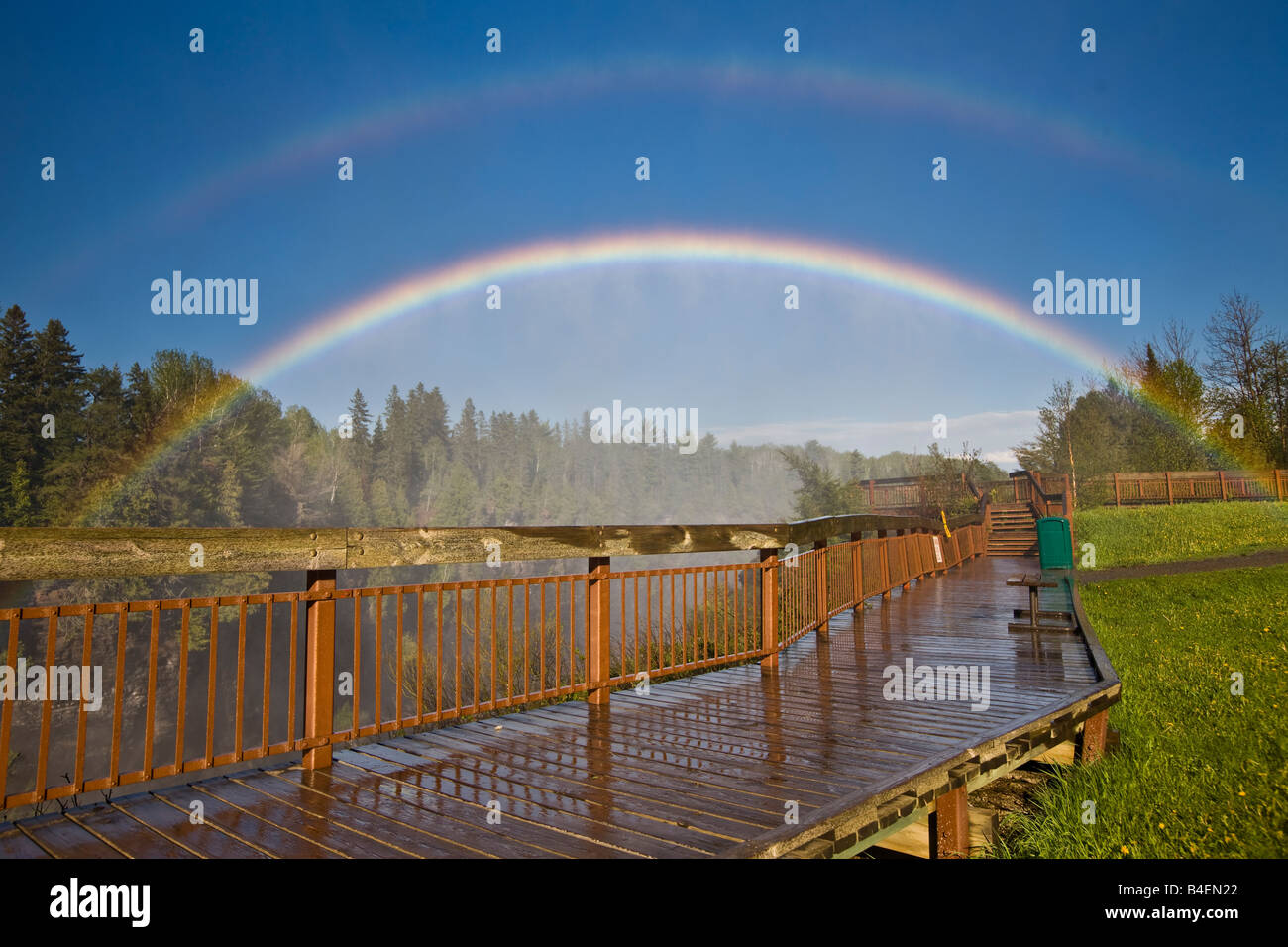 Rainbow in the mist above the boardwalk at Kakabeka Falls (aka Niagara ...