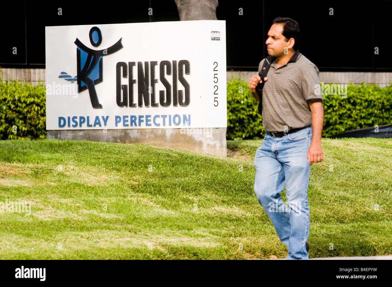 Genesis Display perfection headquarters sign and man walking by Stock ...