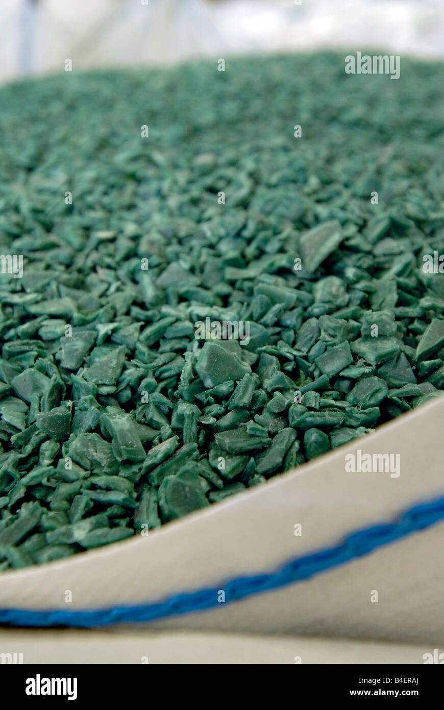 Washed plastic flake from recycled supermarket trays awaiting melting ...