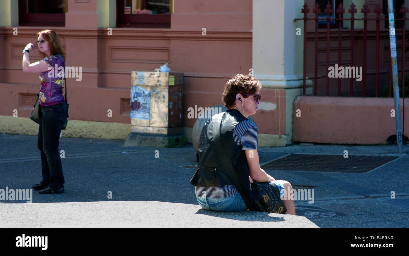 A man and woman ignore each other while they wait Stock Photo - Alamy