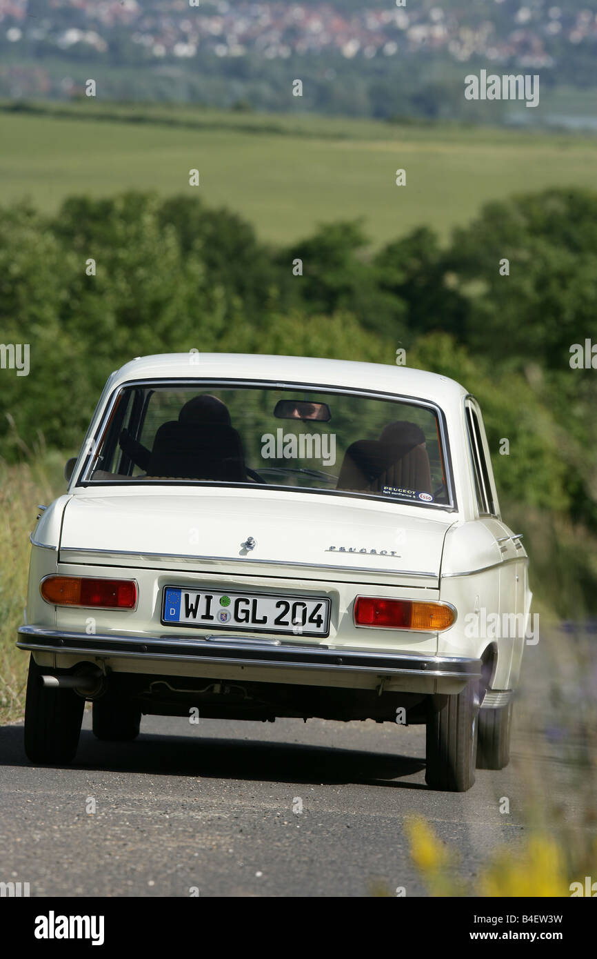 Peugeot 204, vintage car, model year 1965, driving, diagonal back, back ...