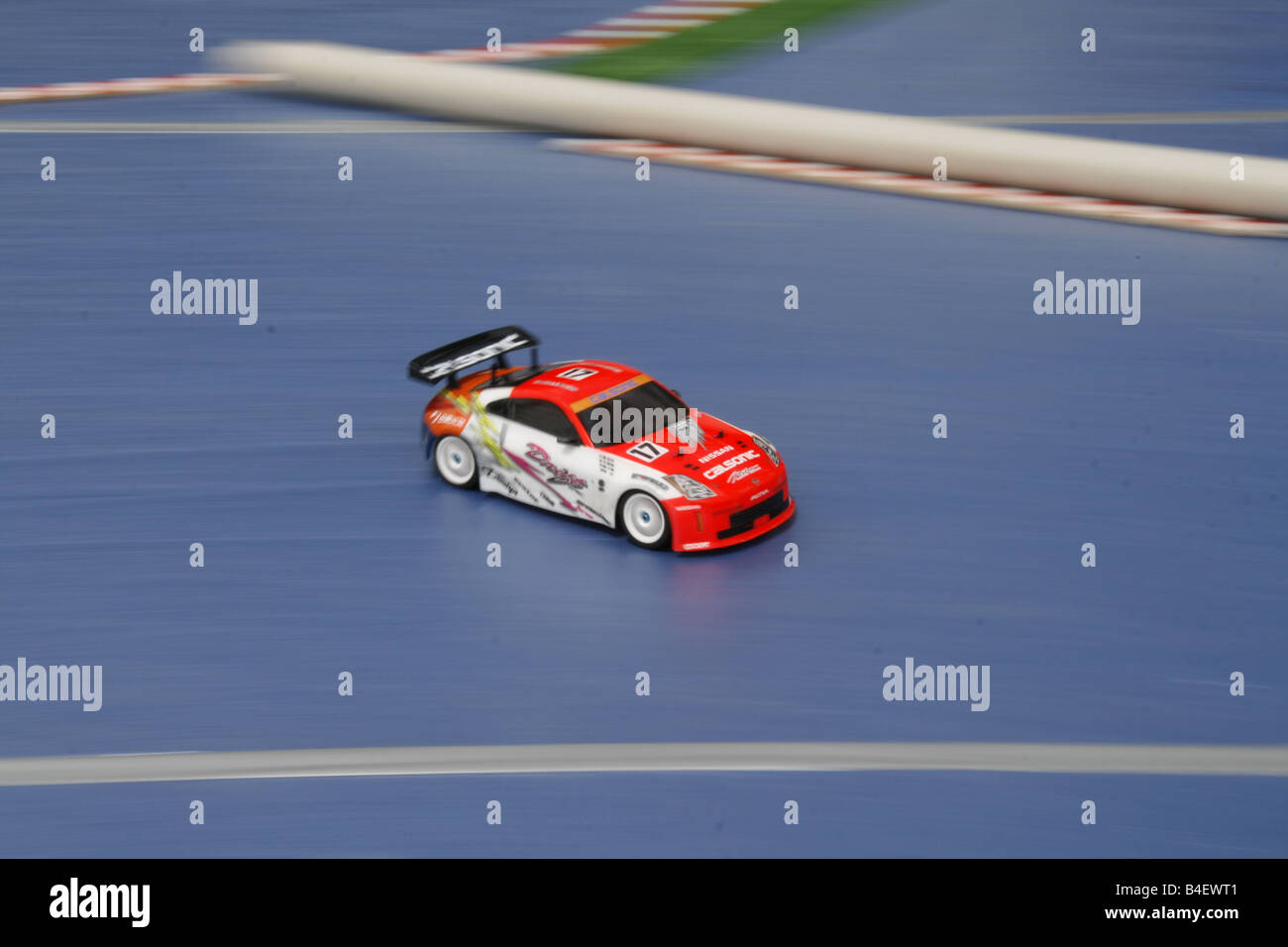 one fast red miniature toy rally car race track Stock Photo - Alamy