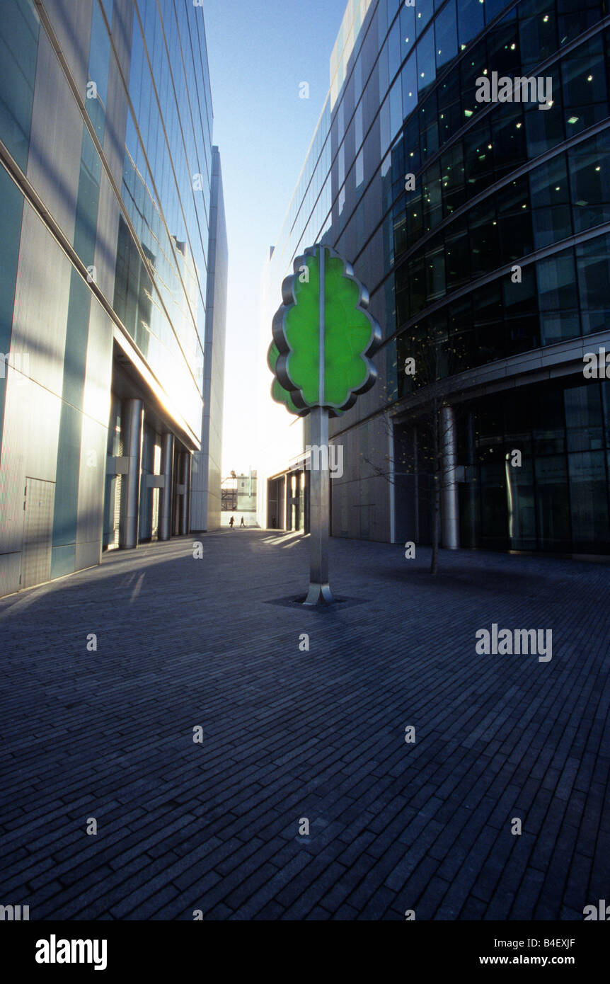 A tree-shaped pole between two buildings in London Stock Photo - Alamy