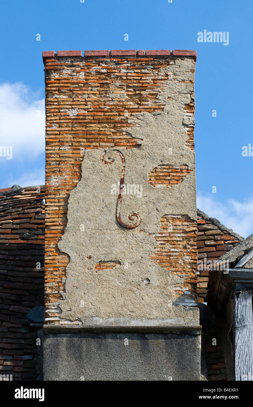Decorative letter "F" reinforcing chimney stack, Bélabre, France Stock ...