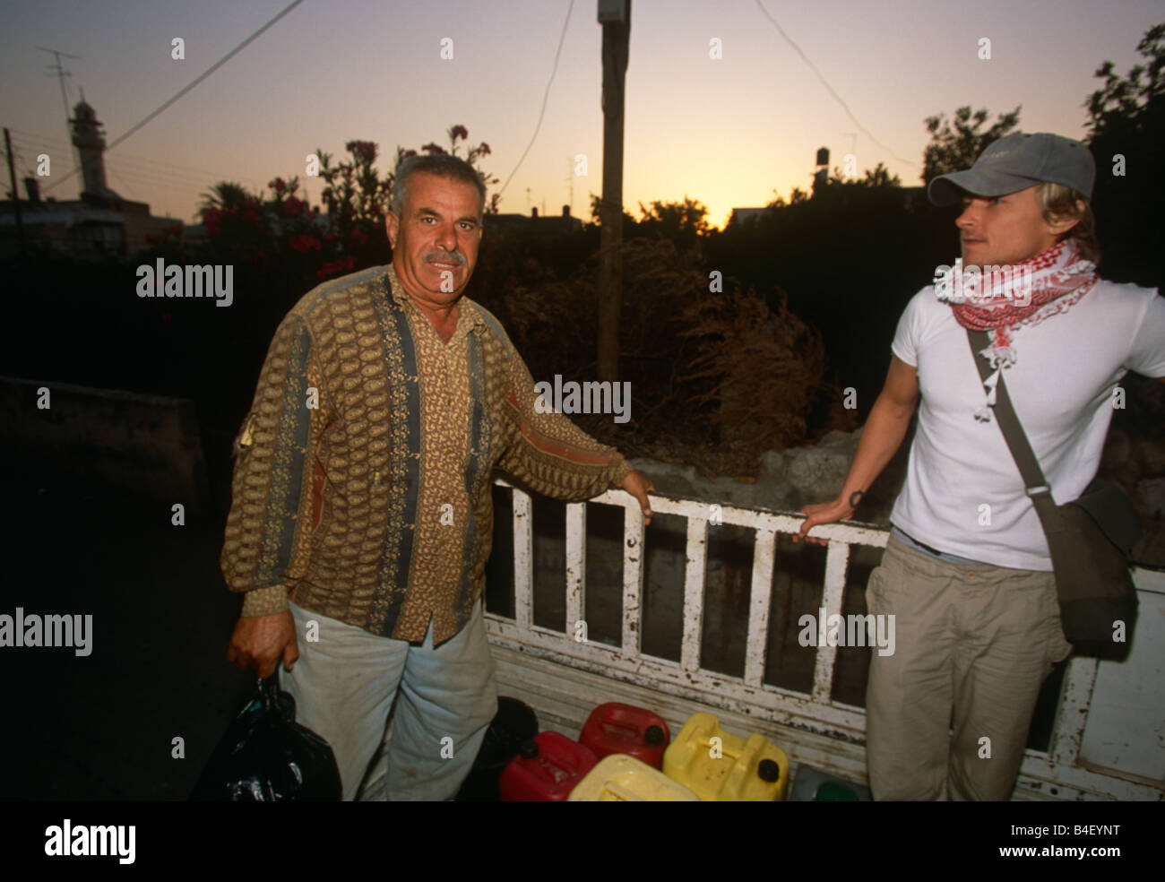 Palestinian man with an NGO volunteer in Palestine Stock Photo - Alamy