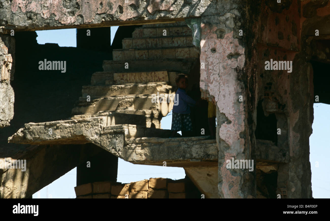 Homeless child in war-ravaged building, Angola Stock Photo - Alamy