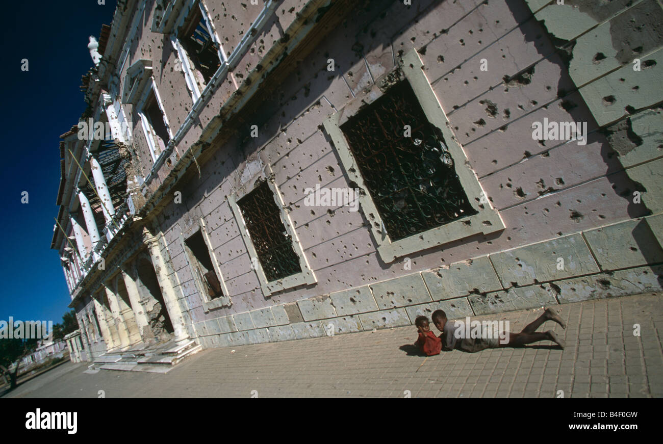 Bullet-riddled building in war-ravaged Angola Stock Photo - Alamy