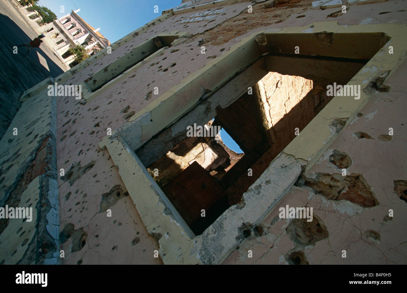 A bullet-riddled building in war-ravaged Angola Stock Photo - Alamy