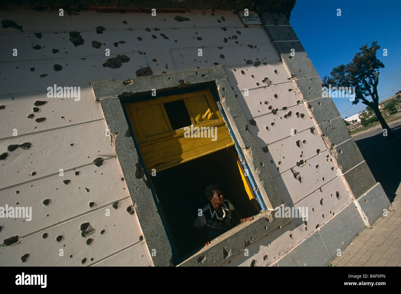 A bullet-riddled building in war-ravaged Angola Stock Photo - Alamy