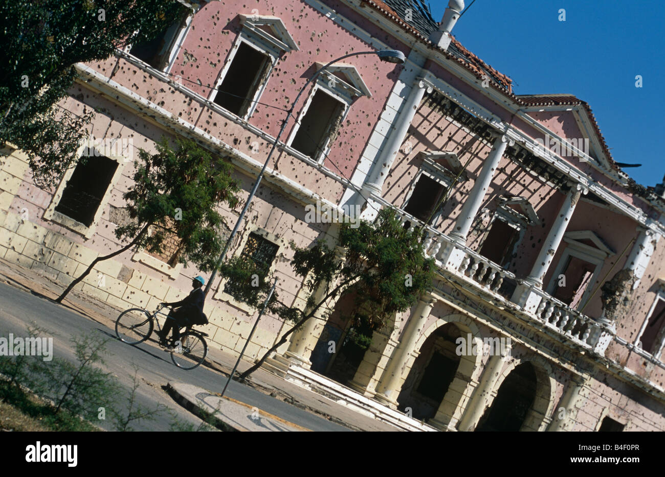 Bullet-riddled building, legacy of civil war in Angola Stock Photo - Alamy