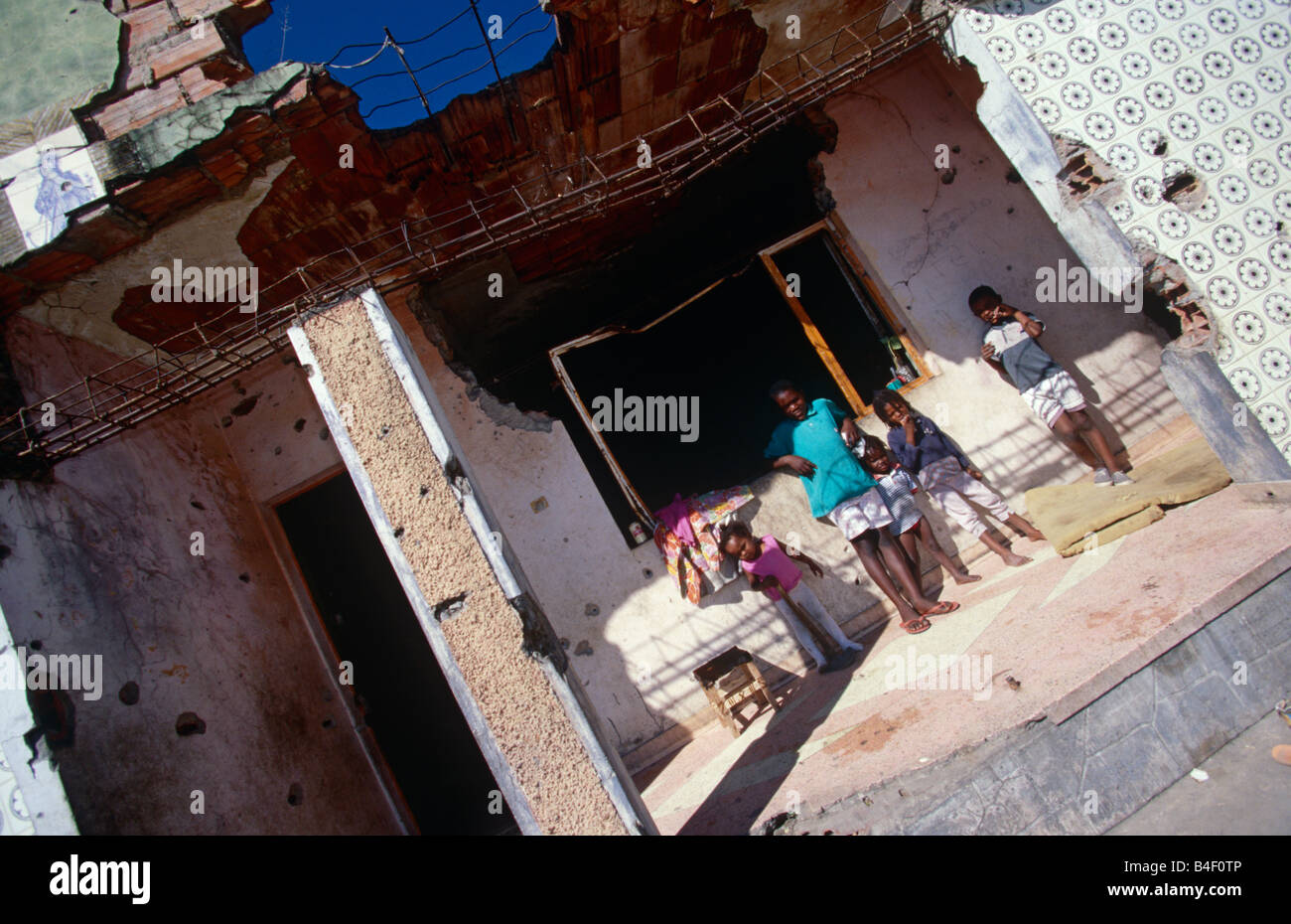 Homeless children sheltering in a damaged building in war-ravaged ...
