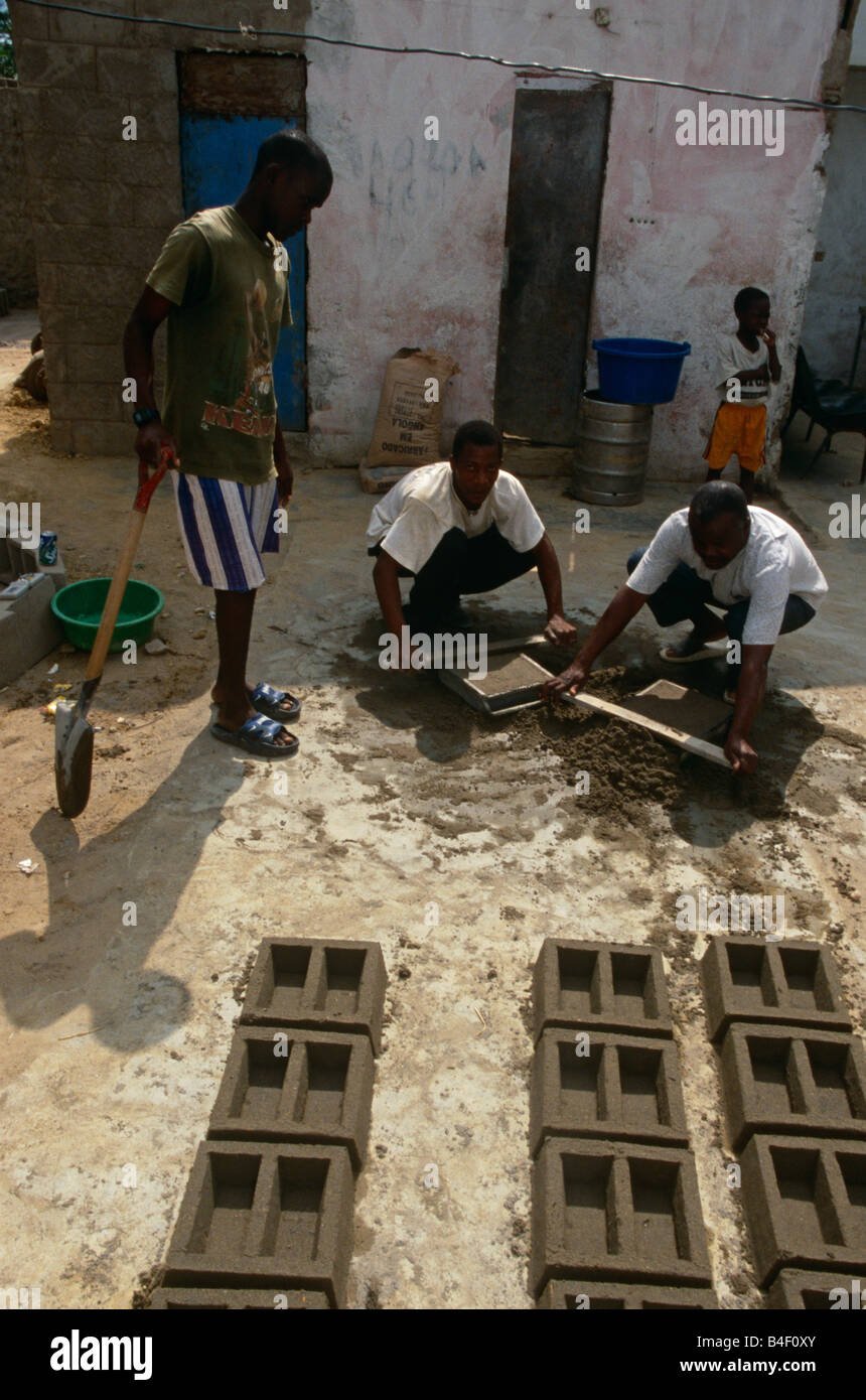 Men making bricks for construction, Angola Stock Photo - Alamy