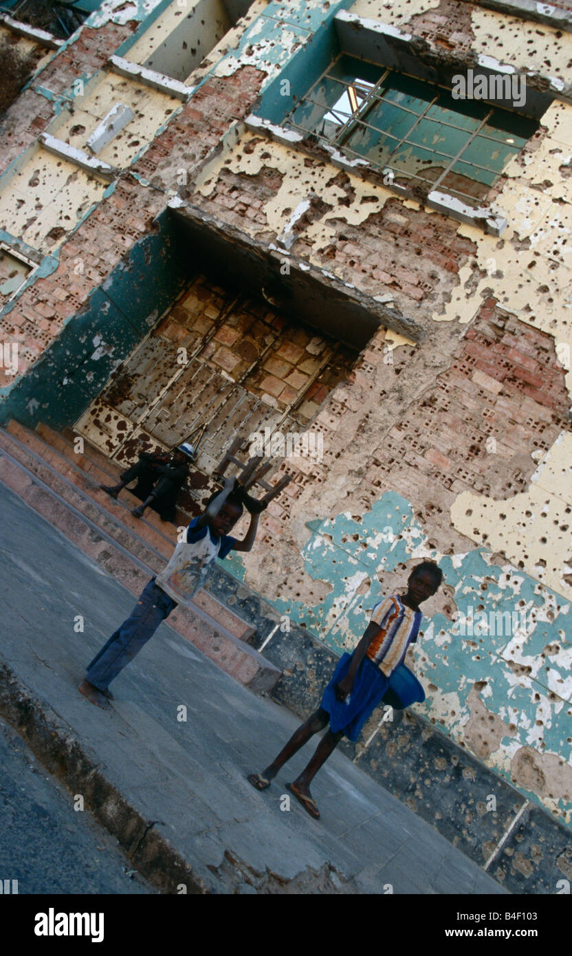 A bullet-riddled building in war-ravaged Angola Stock Photo - Alamy
