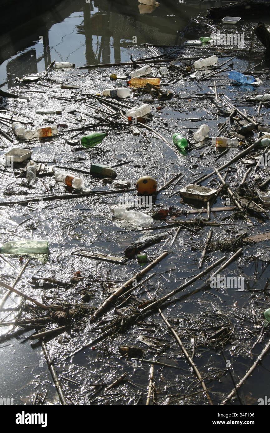 rubbish floating on polluted river surface Stock Photo - Alamy