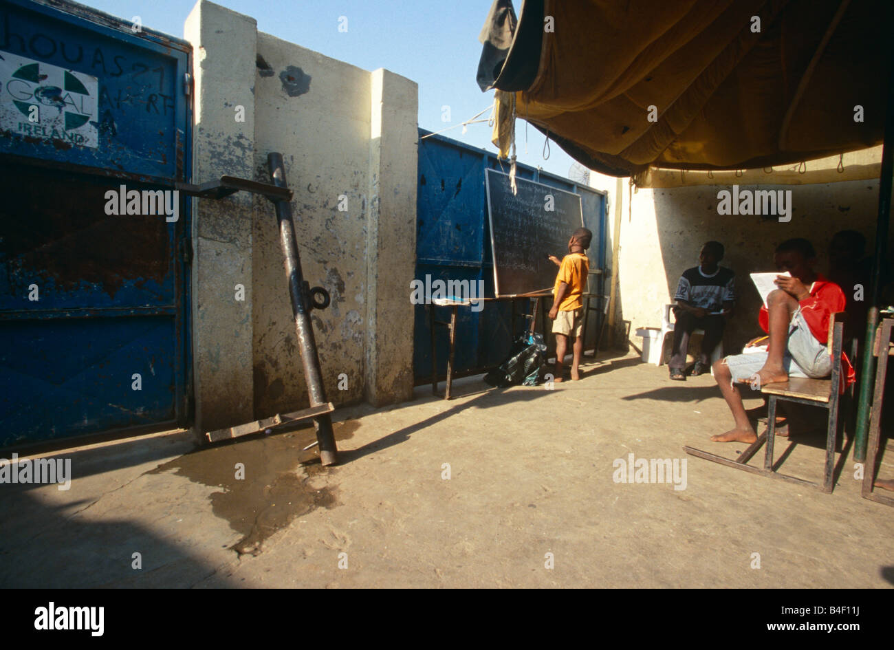 Students studying at a makeshift classroom in Angola Stock Photo - Alamy