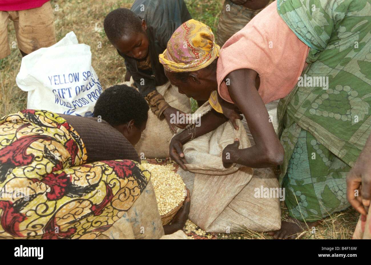 People Receiving Food Supplies Distributed By The WFP In Burundi Stock people-receiving-food-supplies-distributed-by-the-wfp-in-burundi-stock