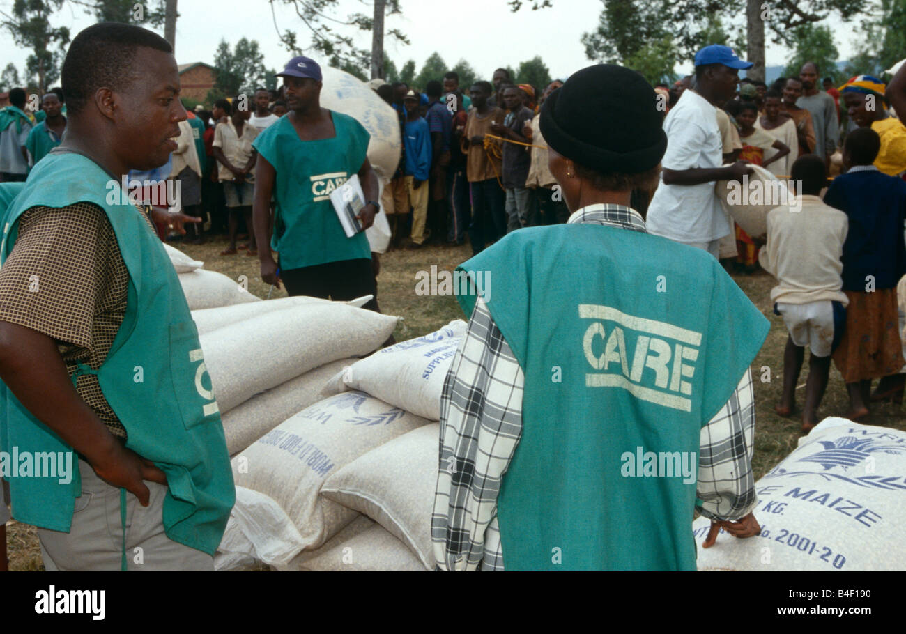 Workers from the NGO CARE distributing WFP supplies in Burundi Stock ...