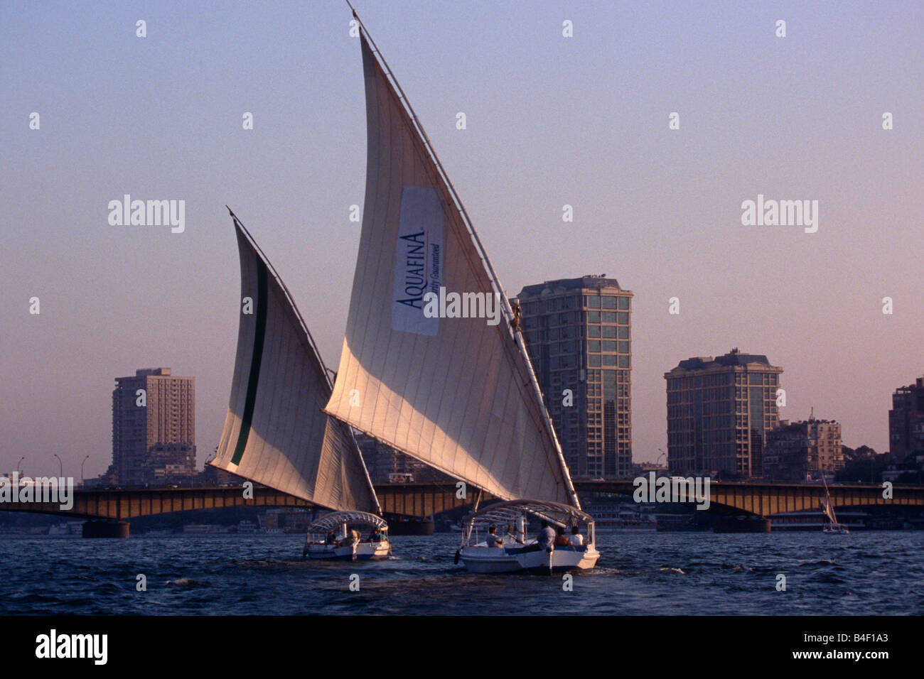 Sailing boats on River Nile and waterfront skyline, Cairo, Egypt ...