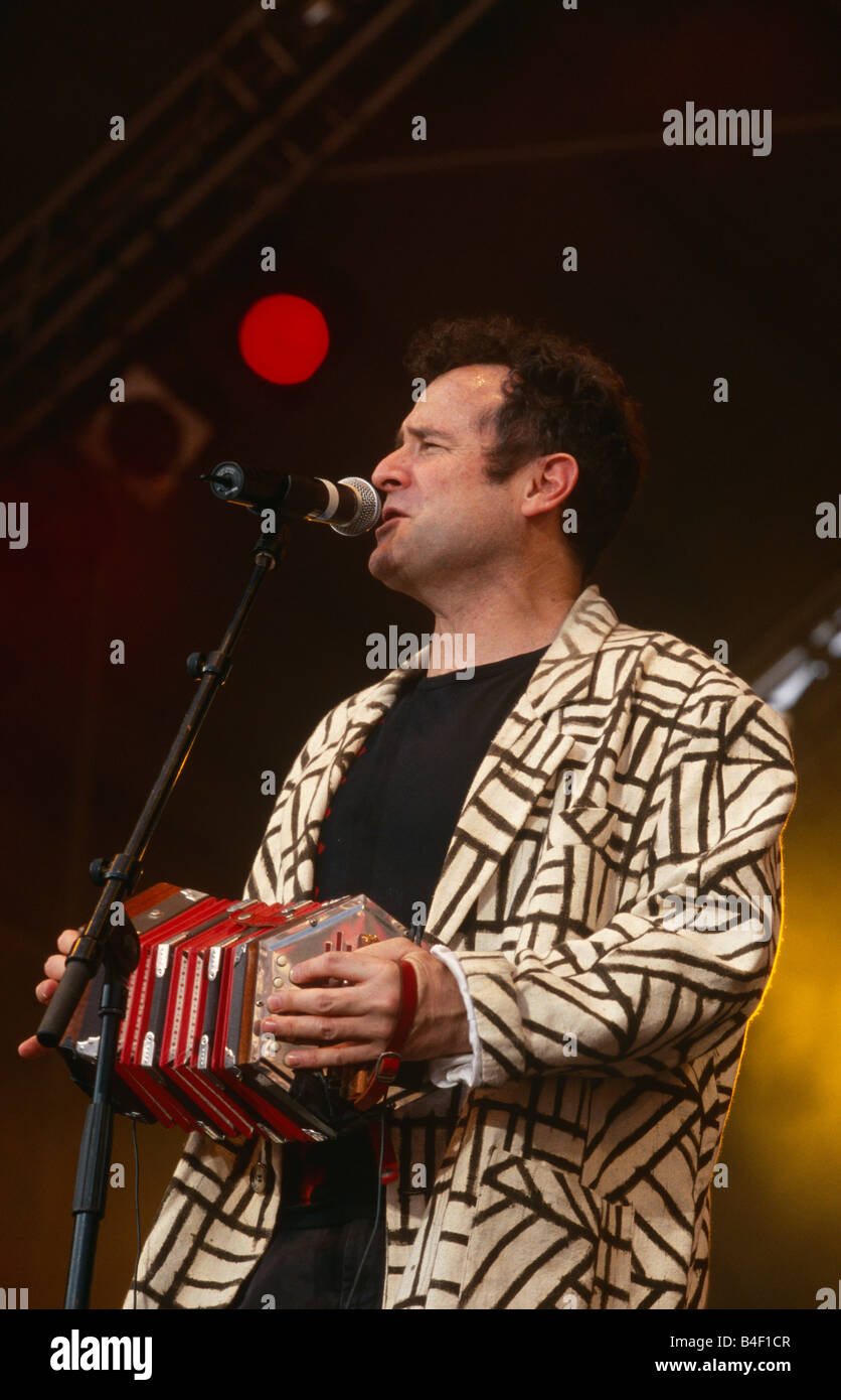 South African musician Johnny Clegg performing on stage Stock Photo - Alamy