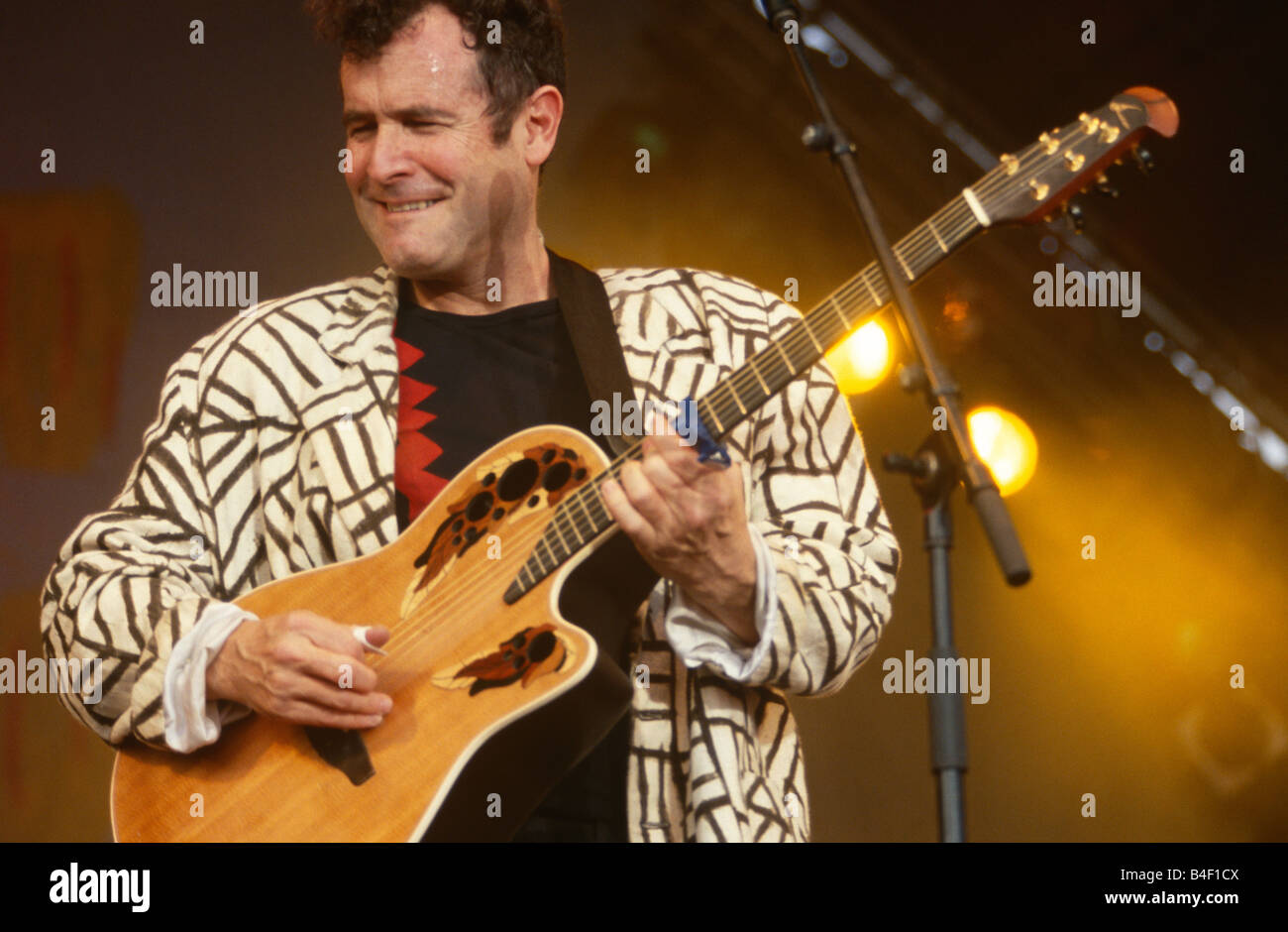 South African musician Johnny Clegg performing on stage Stock Photo - Alamy