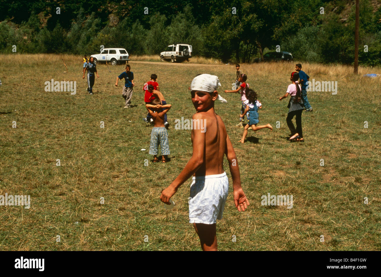 Albanian and Serbian children playing together in field, Kosovo ...