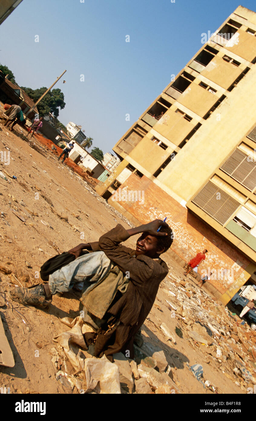 Homeless man sitting on street, Angola, Africa Stock Photo - Alamy