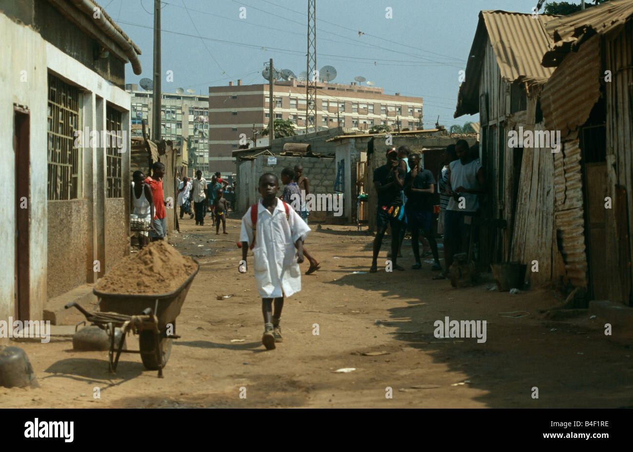 Street scene with schoolboy walking in slum area, Angola, Africa Stock ...