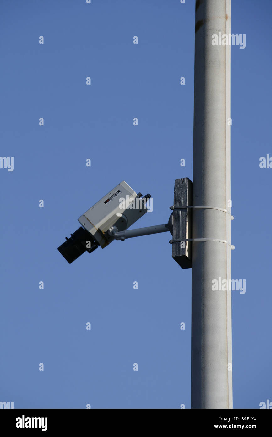 one cctv camera on high pole outdoors in sun Stock Photo - Alamy