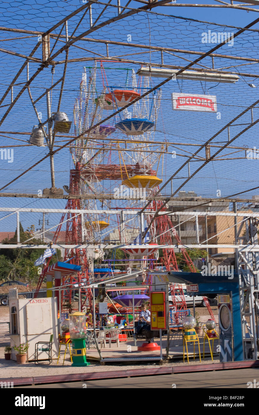 An Empty Fairground with Big Wheel Ride Basking in Summer Sunshine in ...