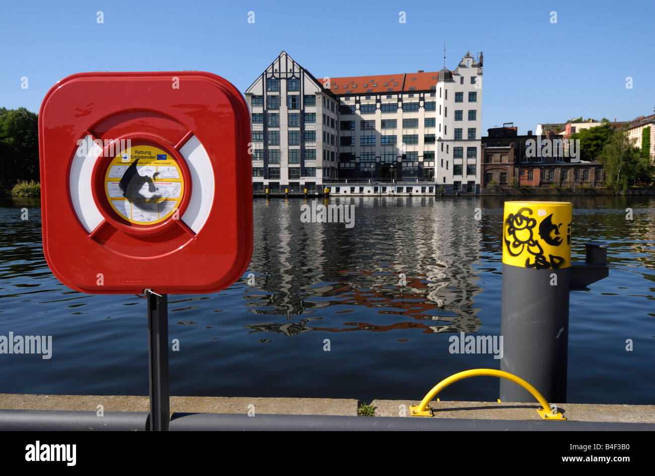 Waterfront buildings on river Spree and O2 World mooring dock, Berlin ...