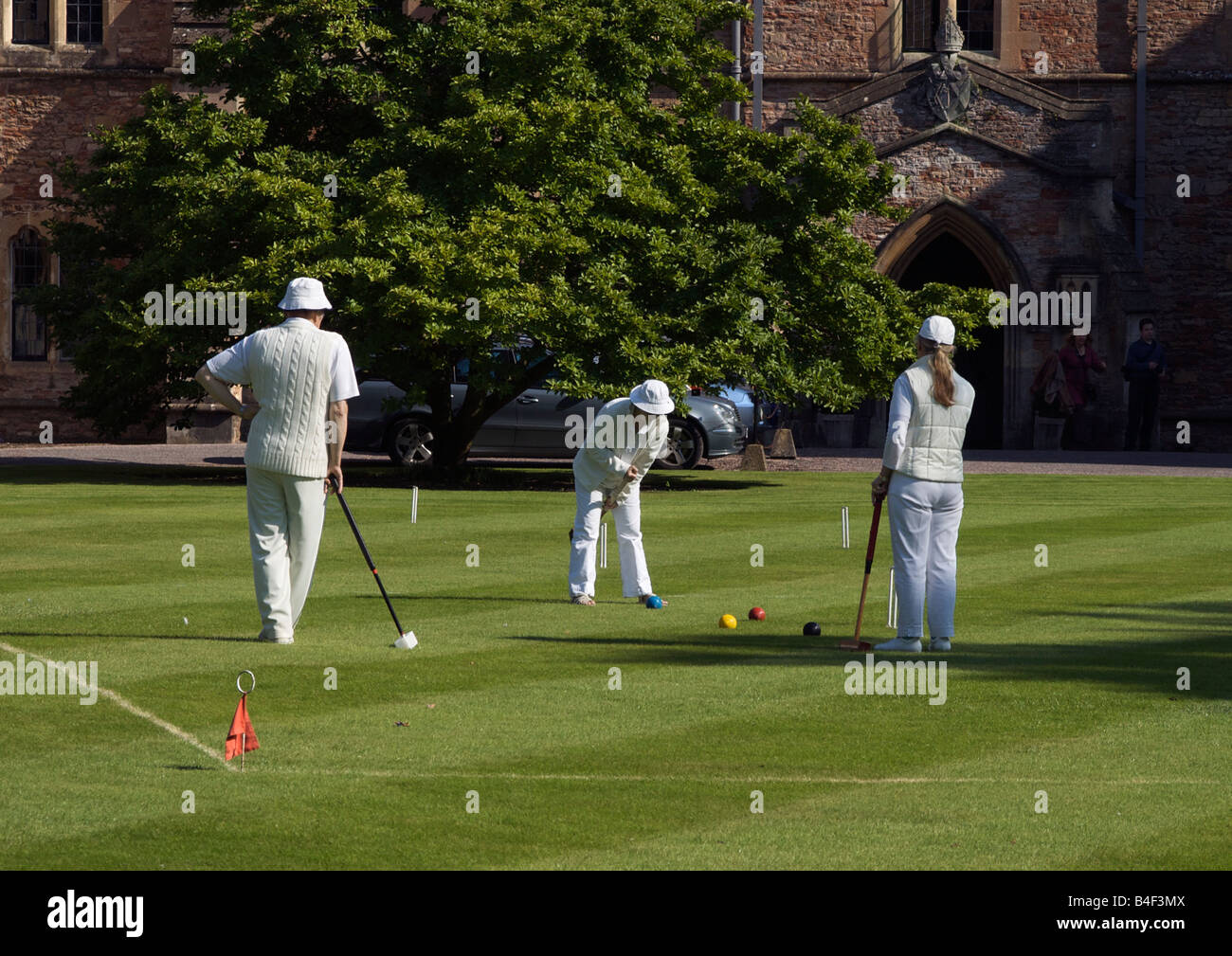 Woman in whites playing croquet hi-res stock photography and images - Alamy